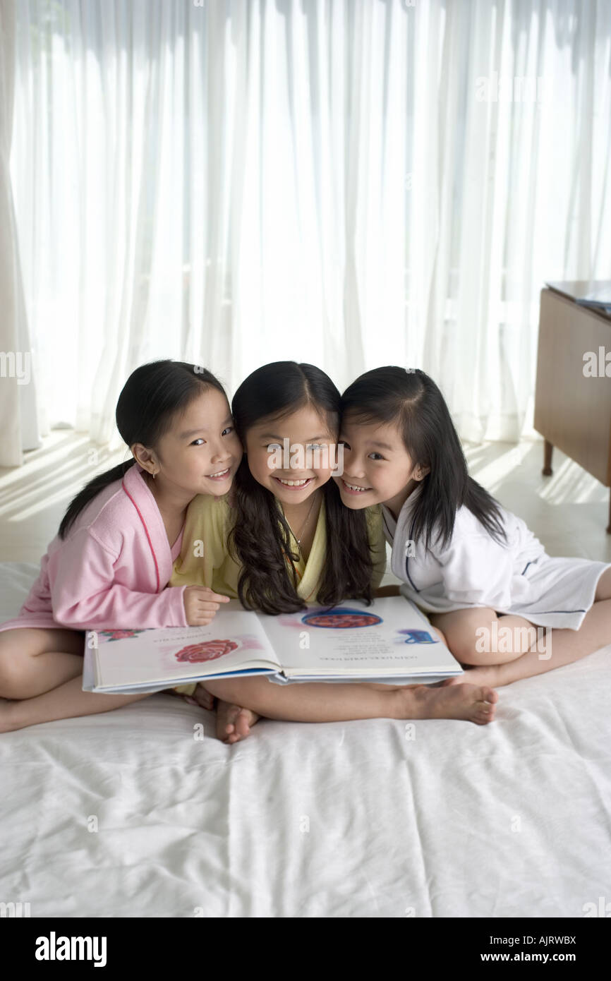 Portrait of three girls smiling Stock Photo - Alamy