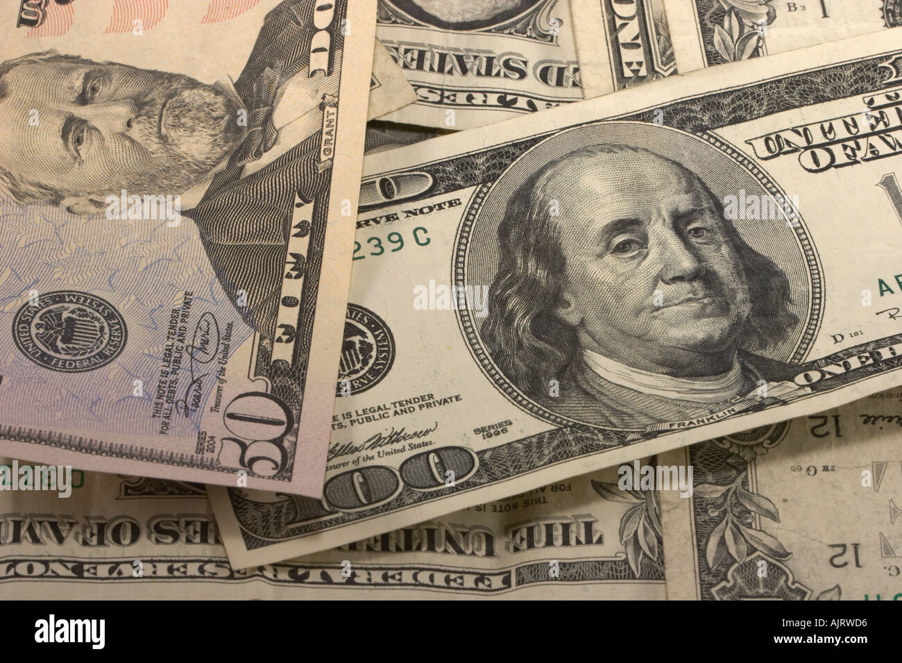 An assortment of denominations of United States currency with hundred ...