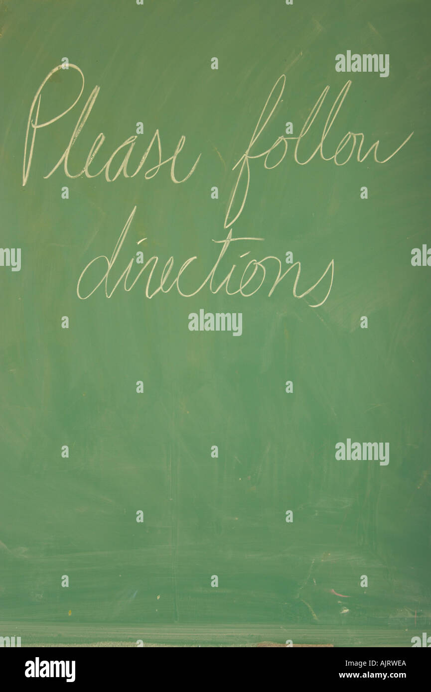 Instructions written on a chalkboard telling students to please follow ...
