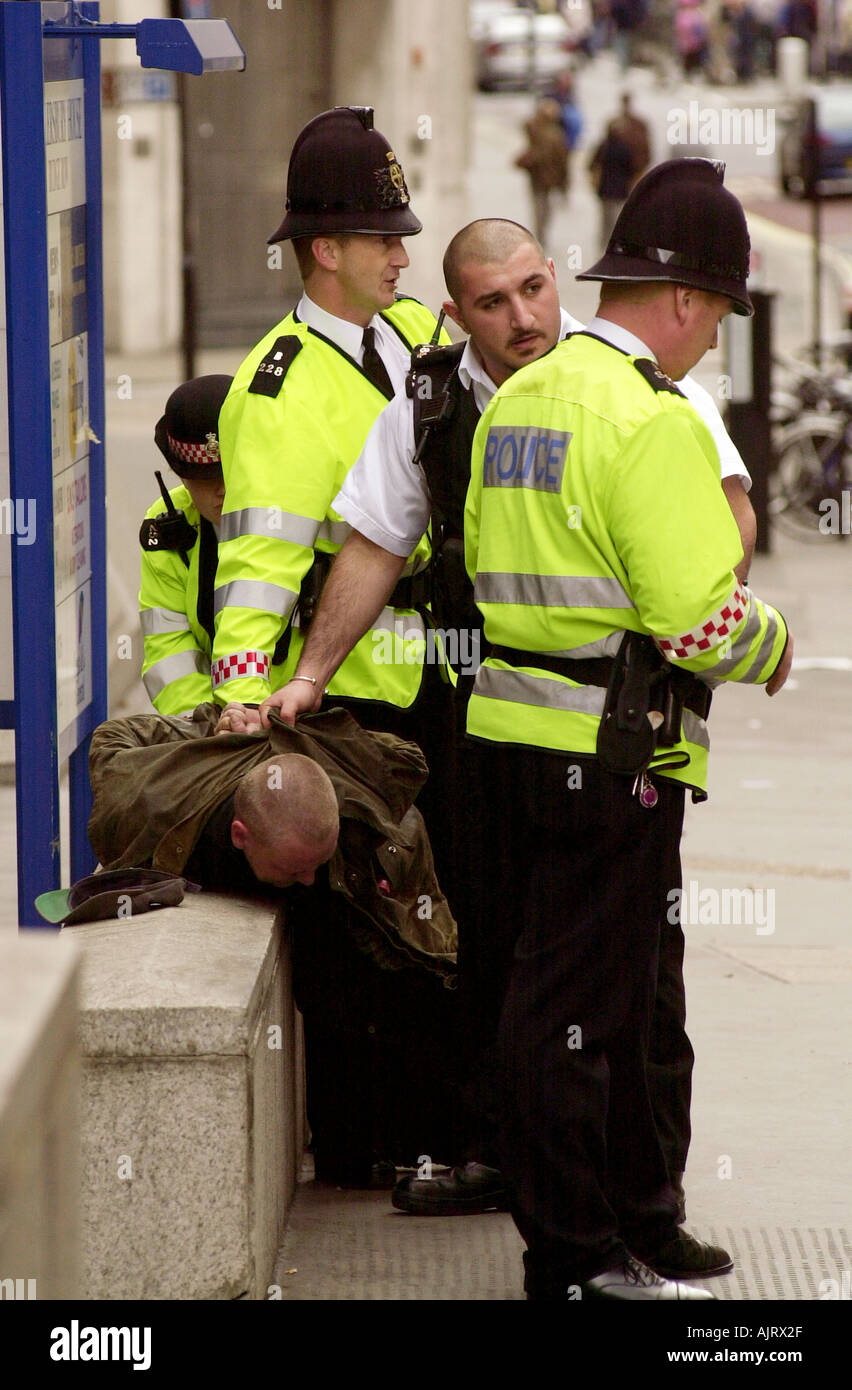An Anti-hunting protester is arrested at the Livelihood demonstration ...