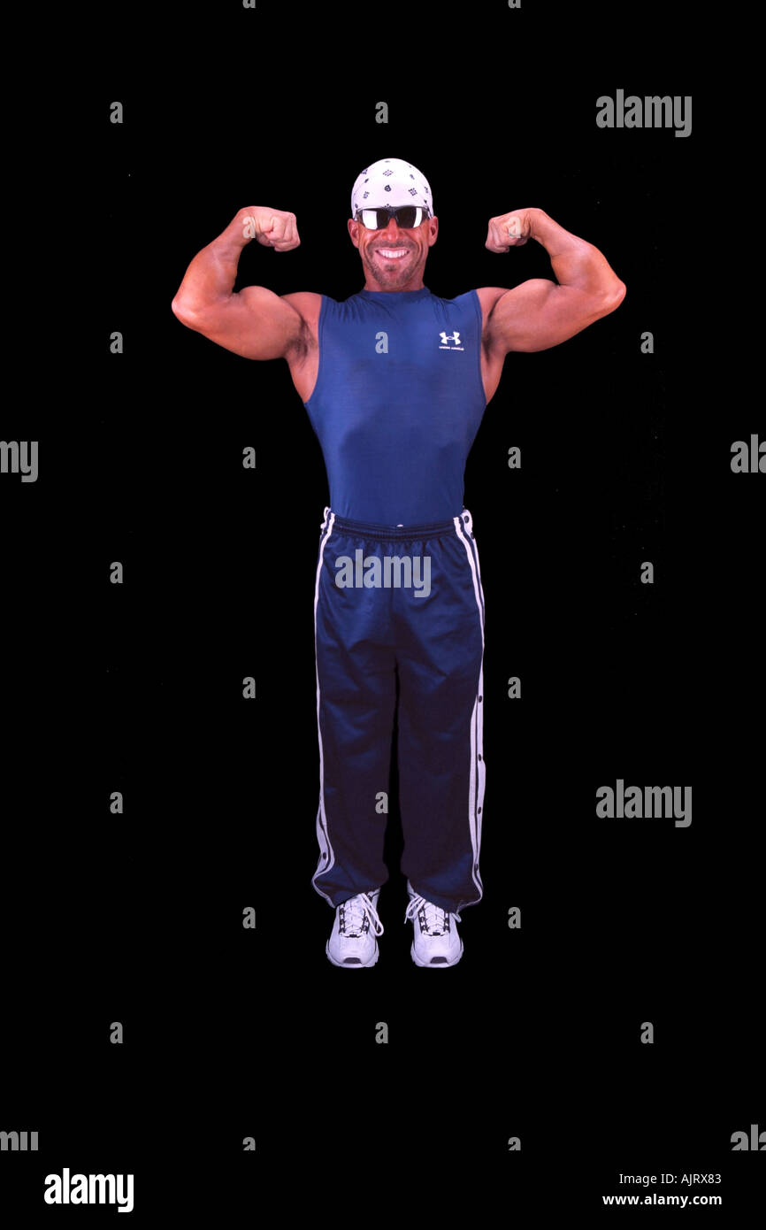 Personal trainer shows muscles Stock Photo - Alamy