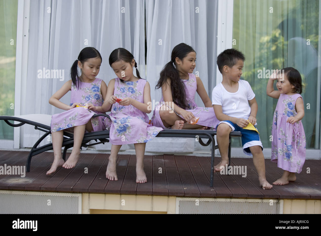 Five children playing together Stock Photo - Alamy