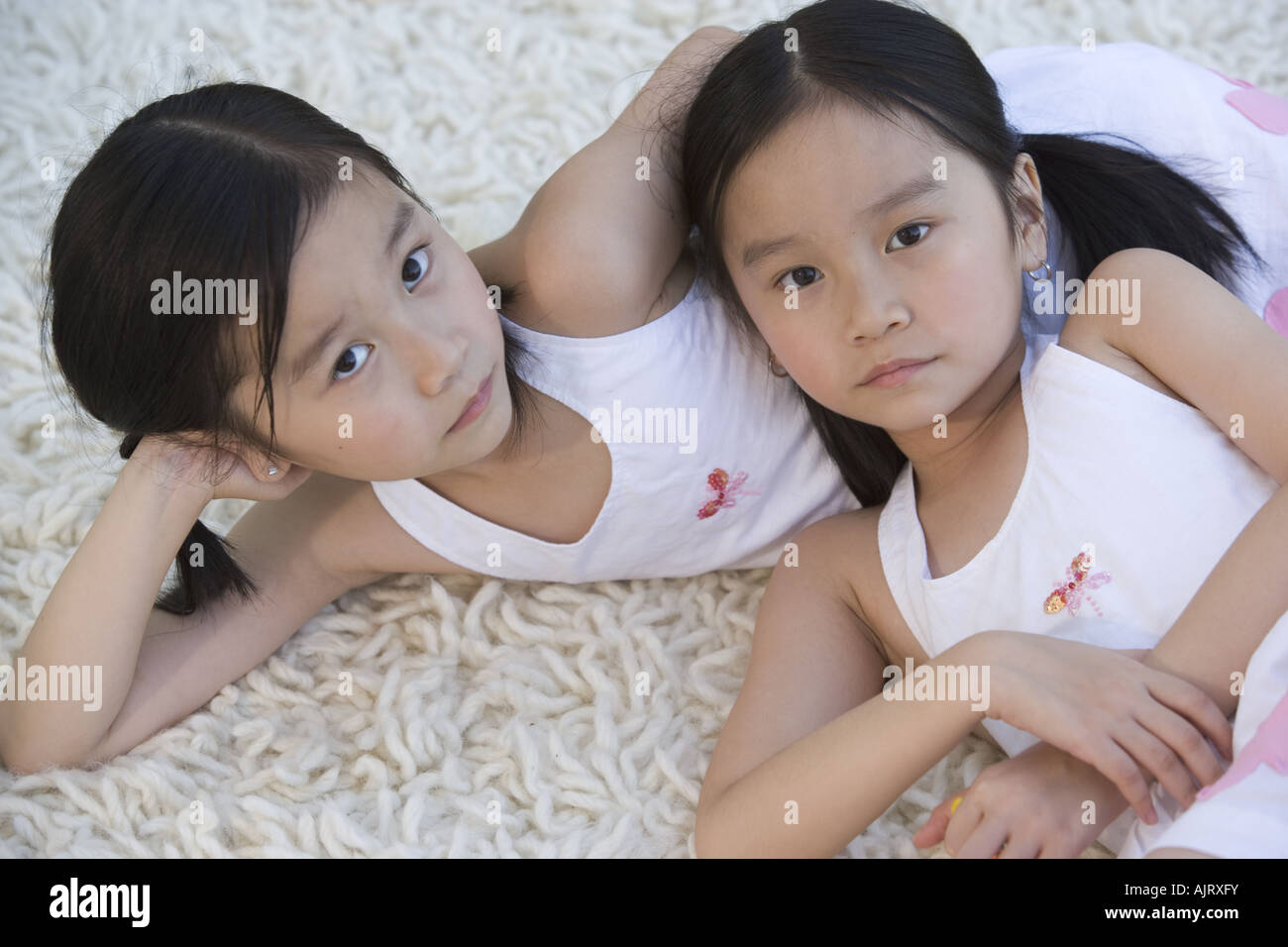 Sisters lying down on hi-res stock photography and images - Alamy