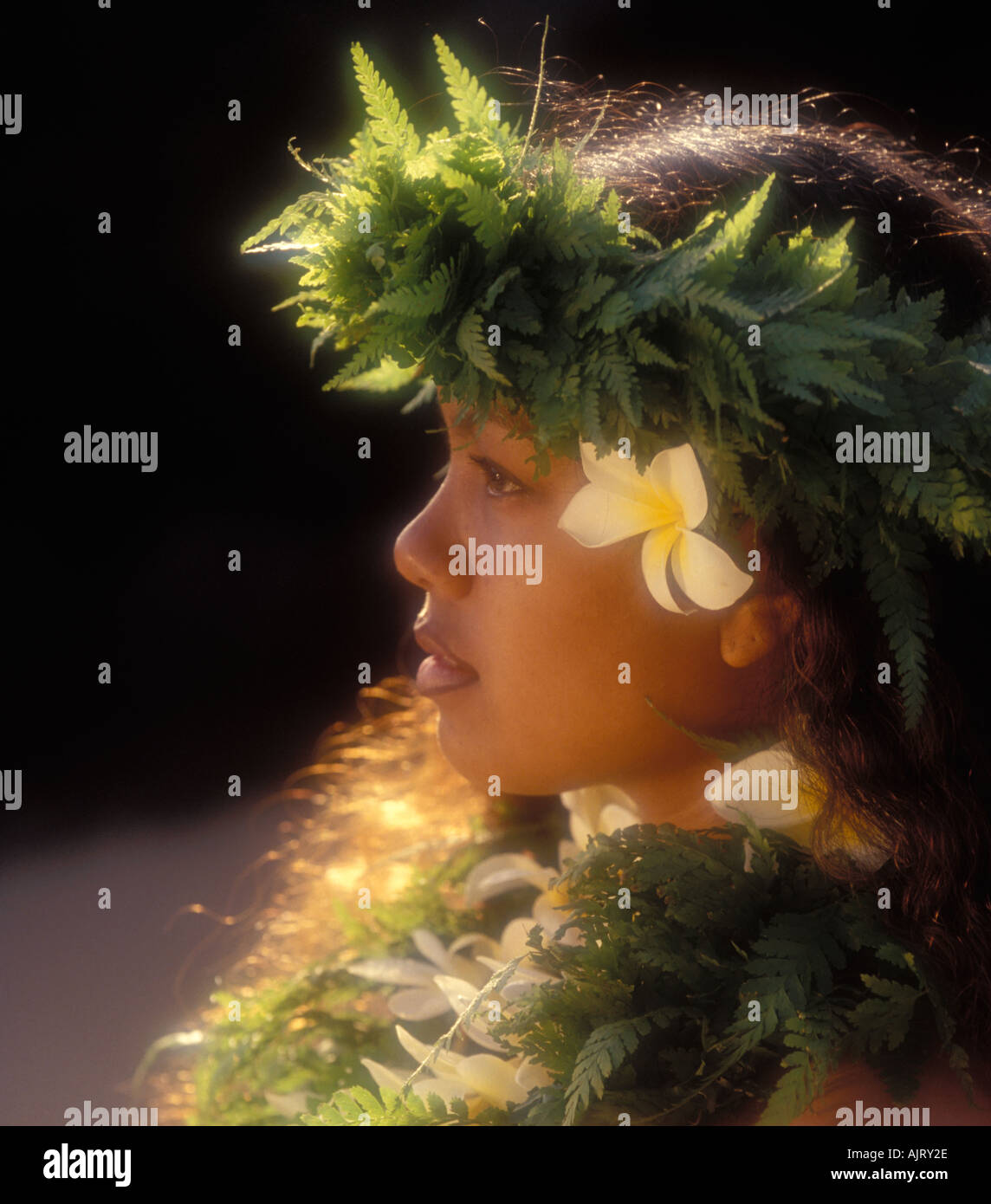 Profile of a Hawaiian girl with ferrns and plumeria flower at Makena ...