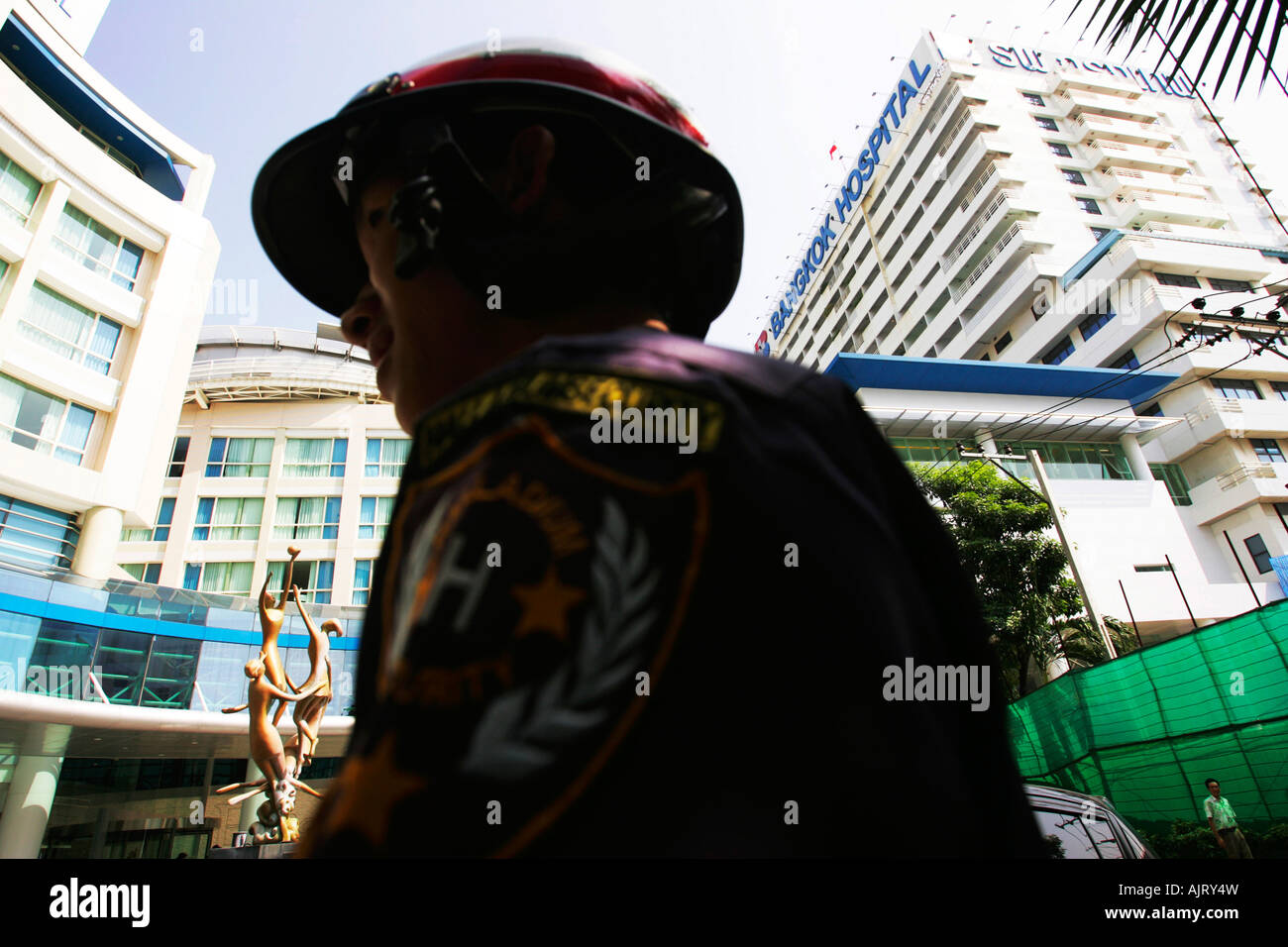 Security guards patrol the entrance of Bangkok Hospital Petchburi Rd ...