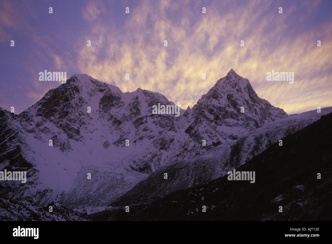 Snowy mountain in shadow Stock Photo - Alamy