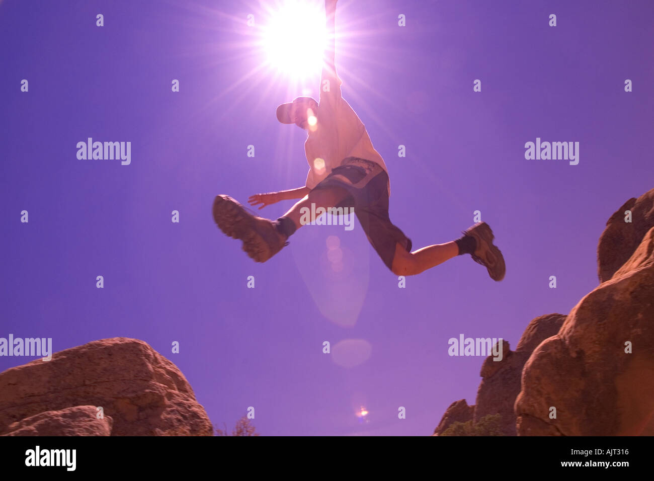 Man on the rocks hi-res stock photography and images - Alamy