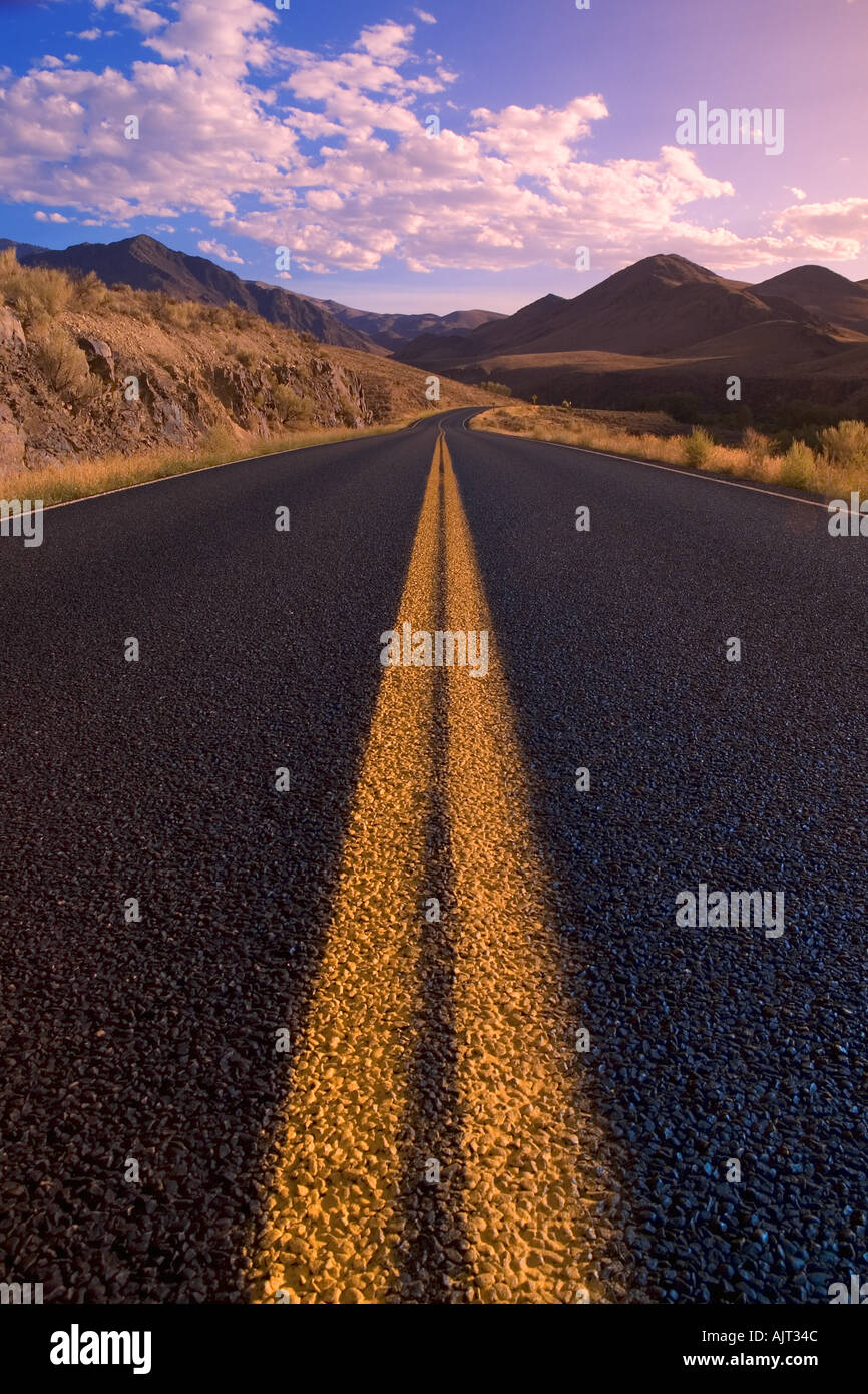 long straight road with a bend Stock Photo - Alamy