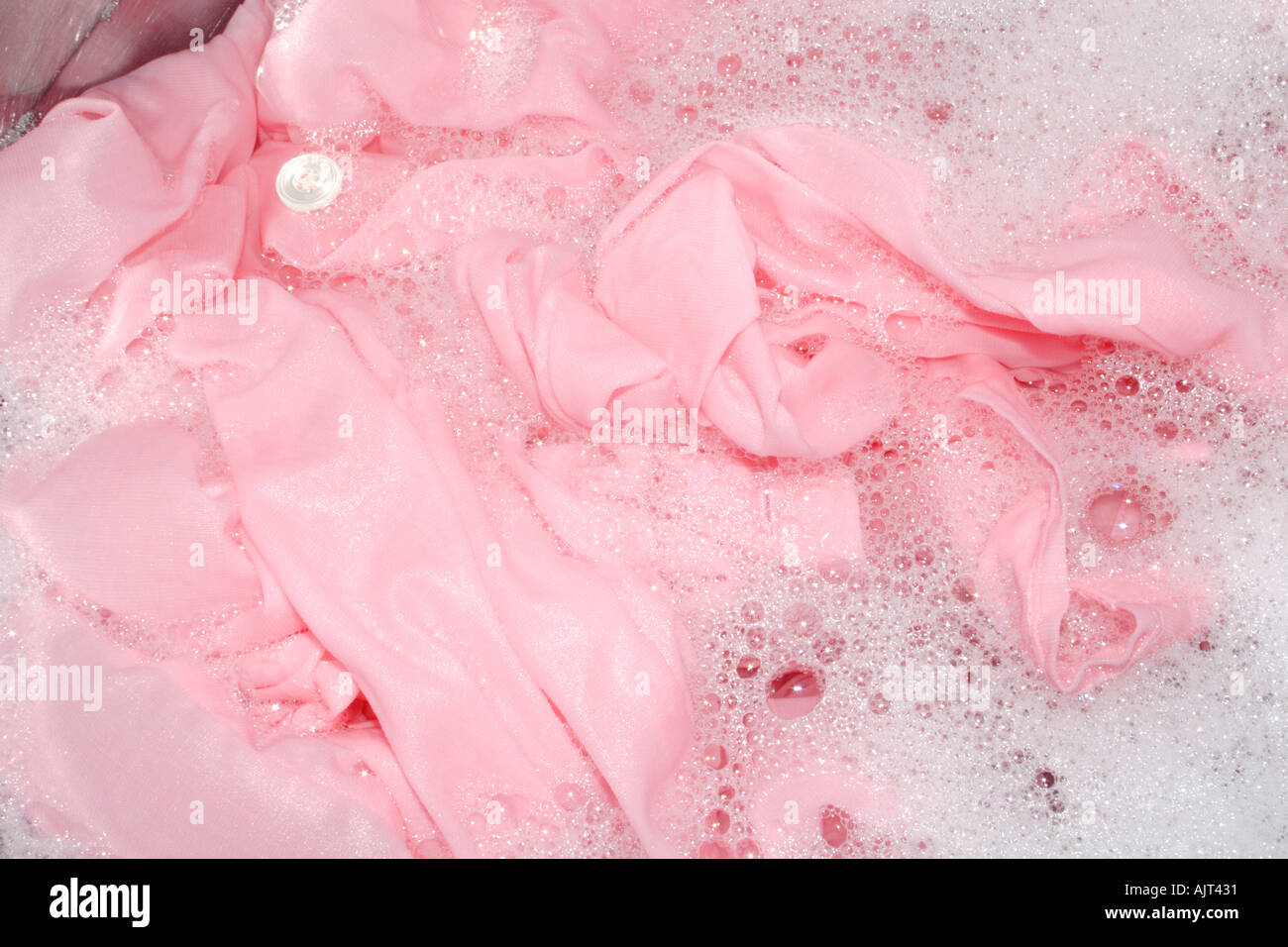 A pink garment being washed Stock Photo - Alamy