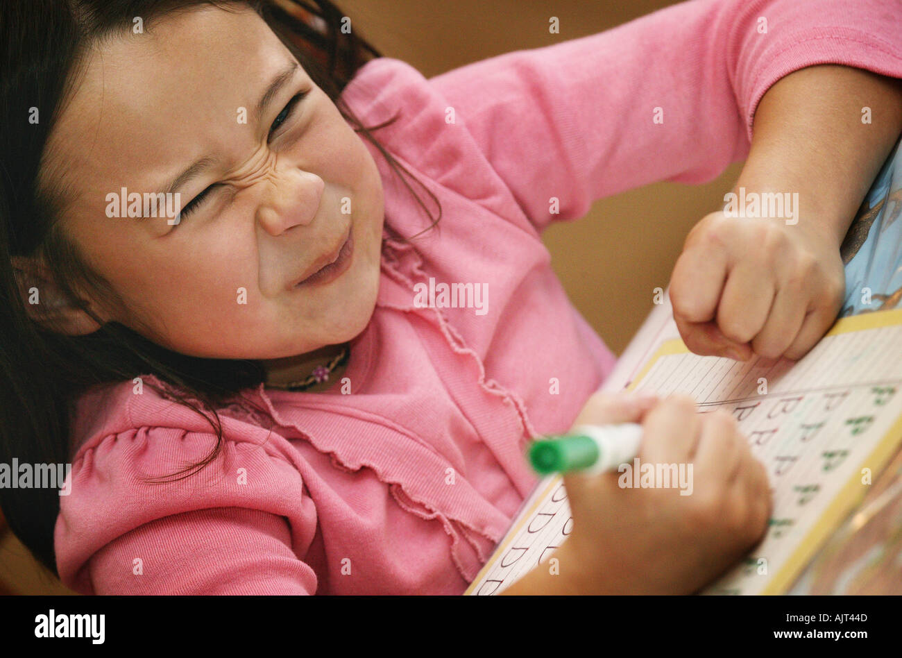 Girl frustrated by school work Stock Photo - Alamy