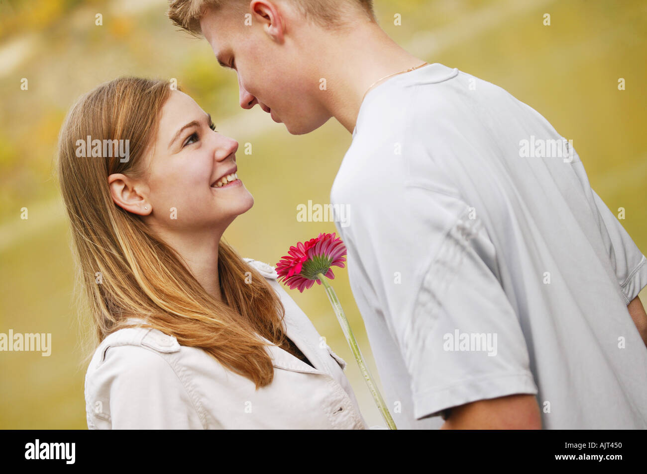 Presenting a flower Stock Photo - Alamy