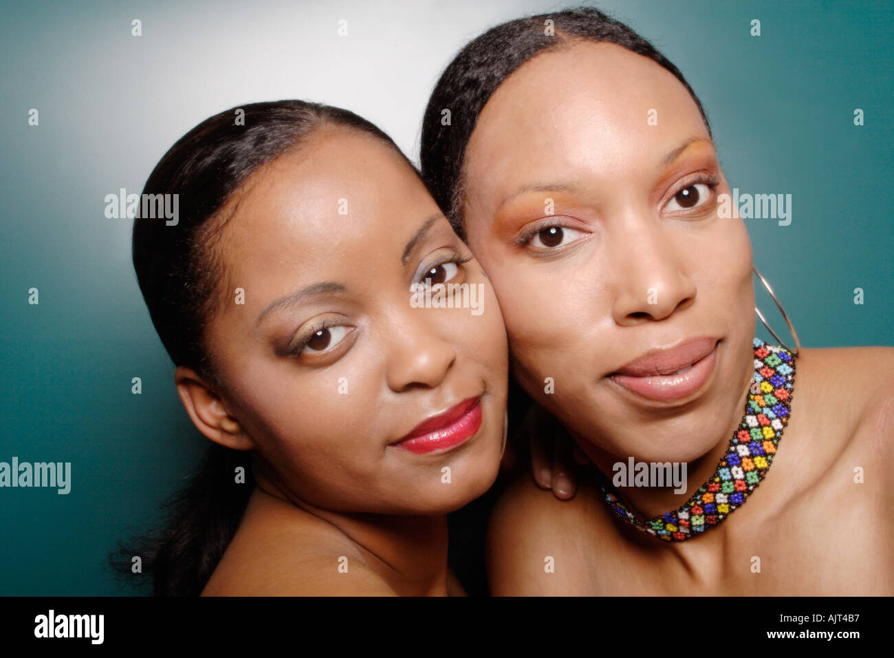 Two black women hugging each other hi-res stock photography and images ...