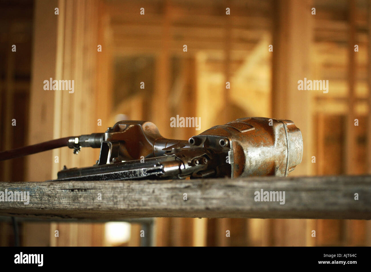Nail gun inside house under construction Stock Photo - Alamy