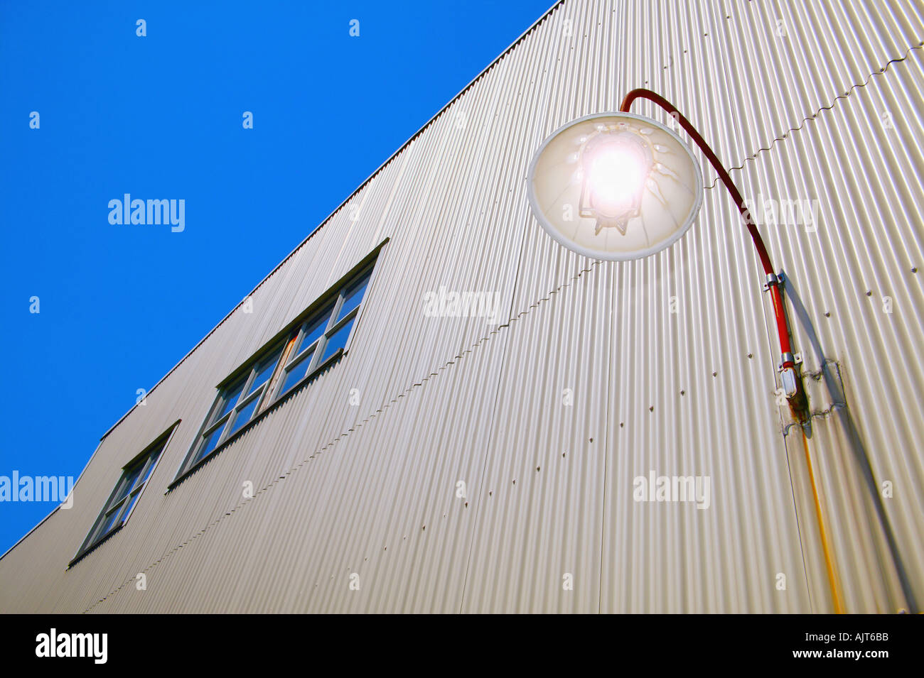 Modern industrial building with outside light Stock Photo - Alamy