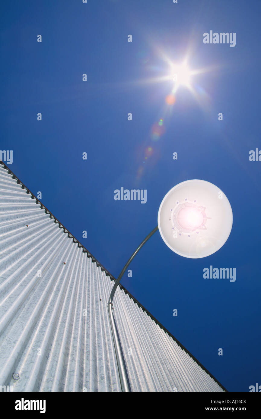 Light on outside building against sun sky Stock Photo - Alamy