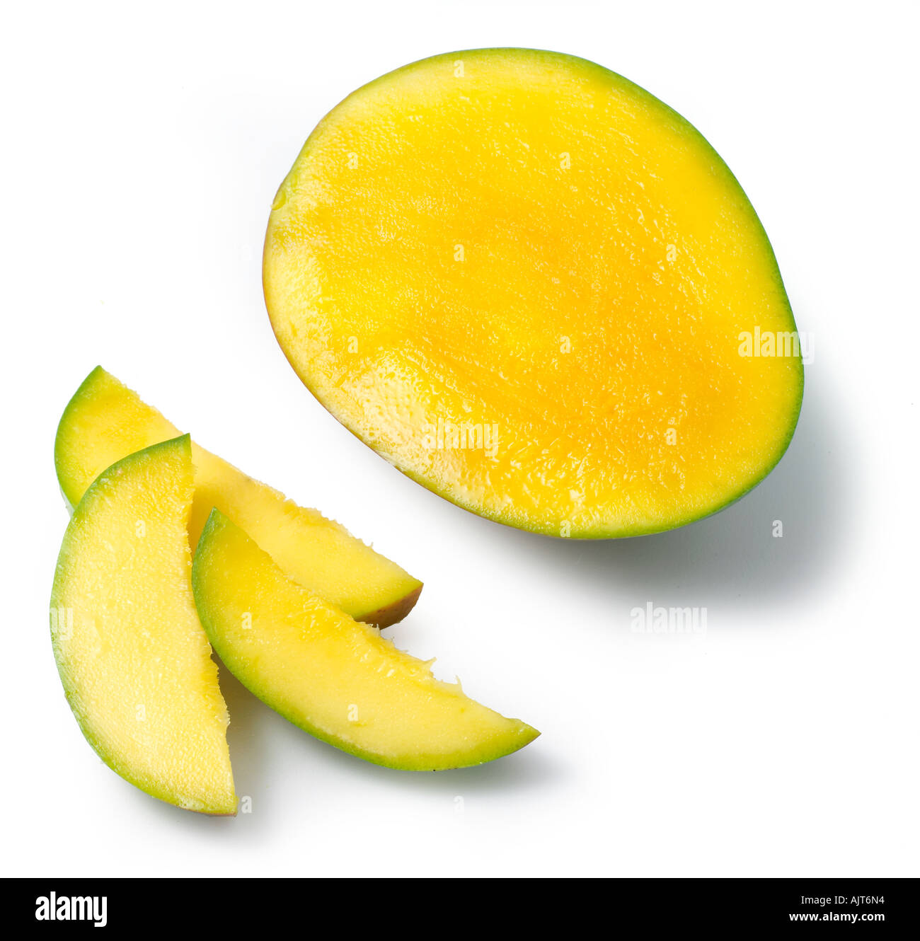Mango slices cut out onto a white background Stock Photo - Alamy