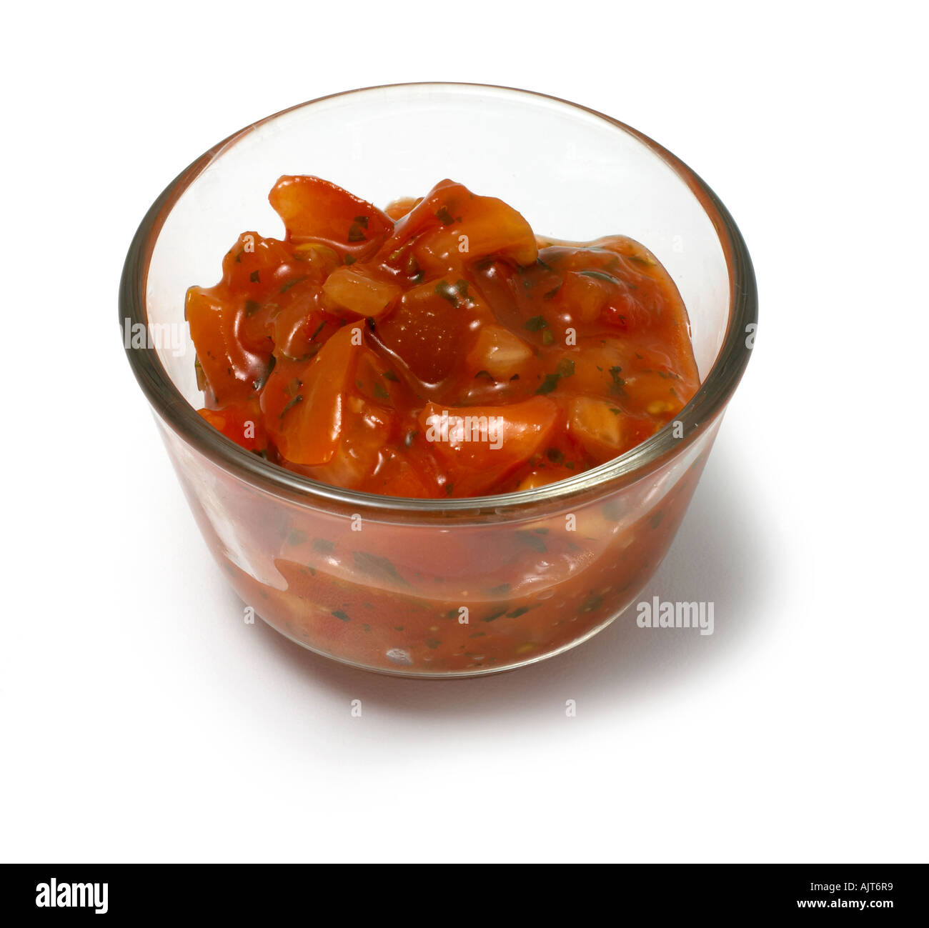 Salsa in a glass bowl cut out on a white background Stock Photo - Alamy