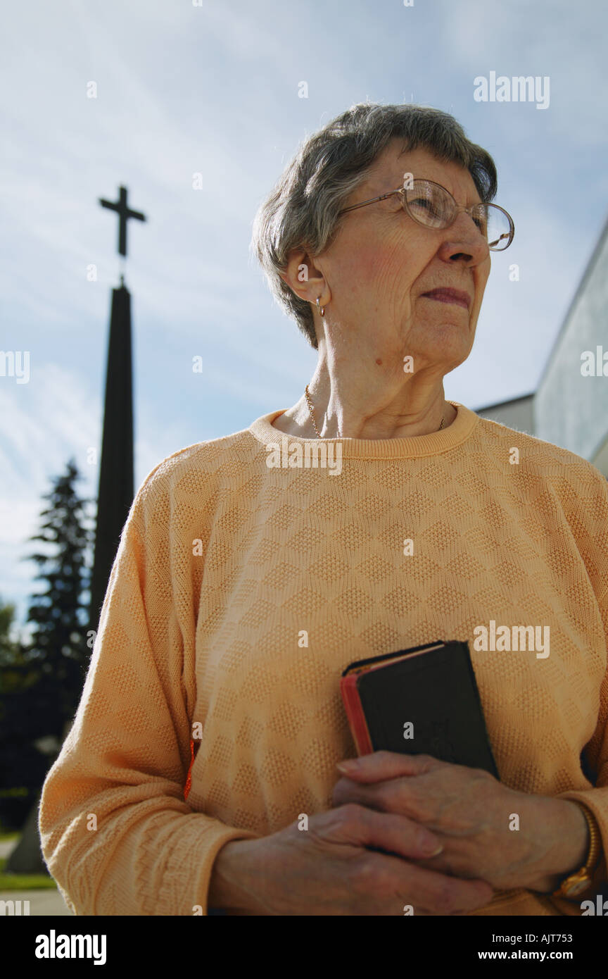 Woman holding bible hi-res stock photography and images - Alamy