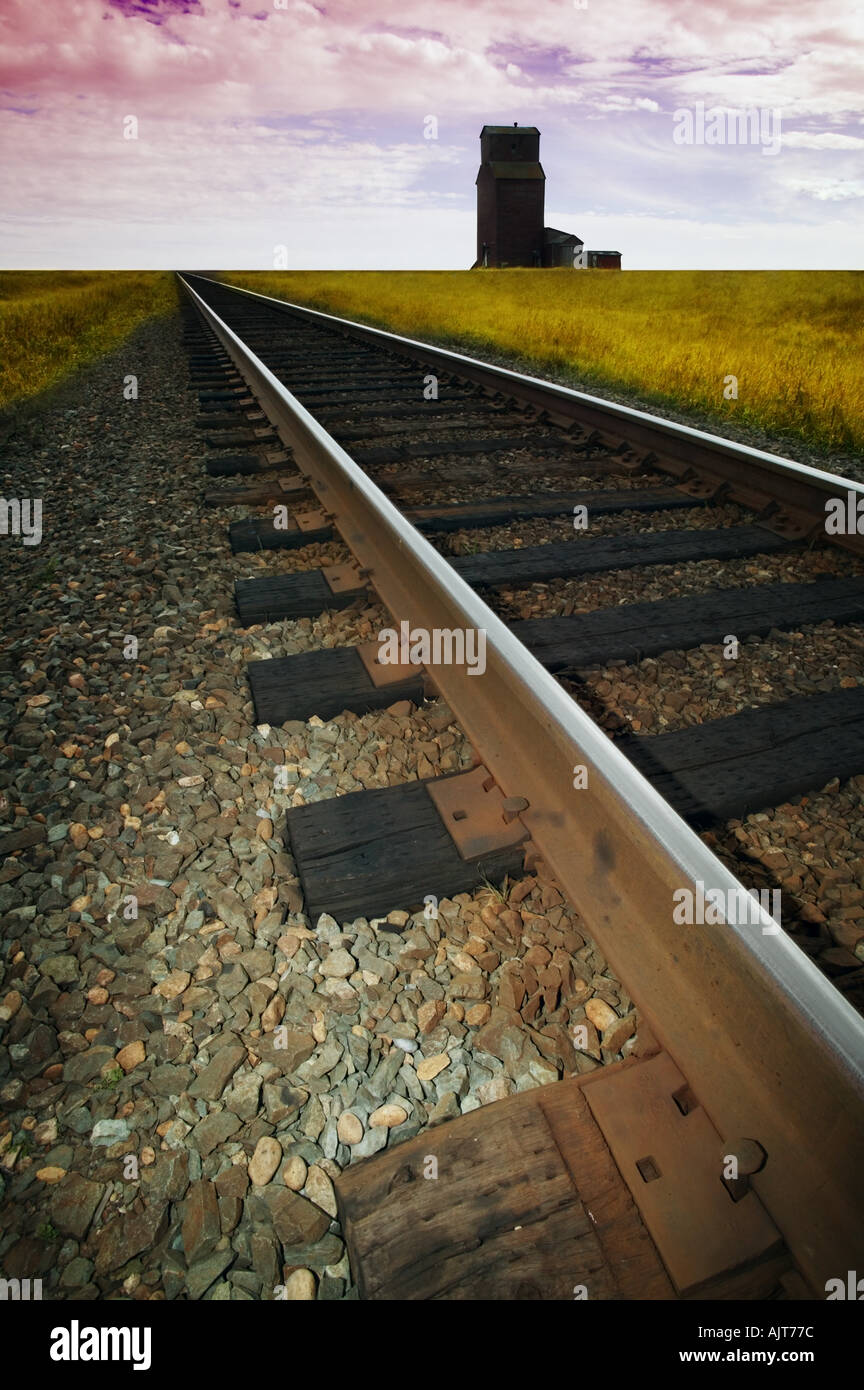 Train track with grain elevator Stock Photo - Alamy