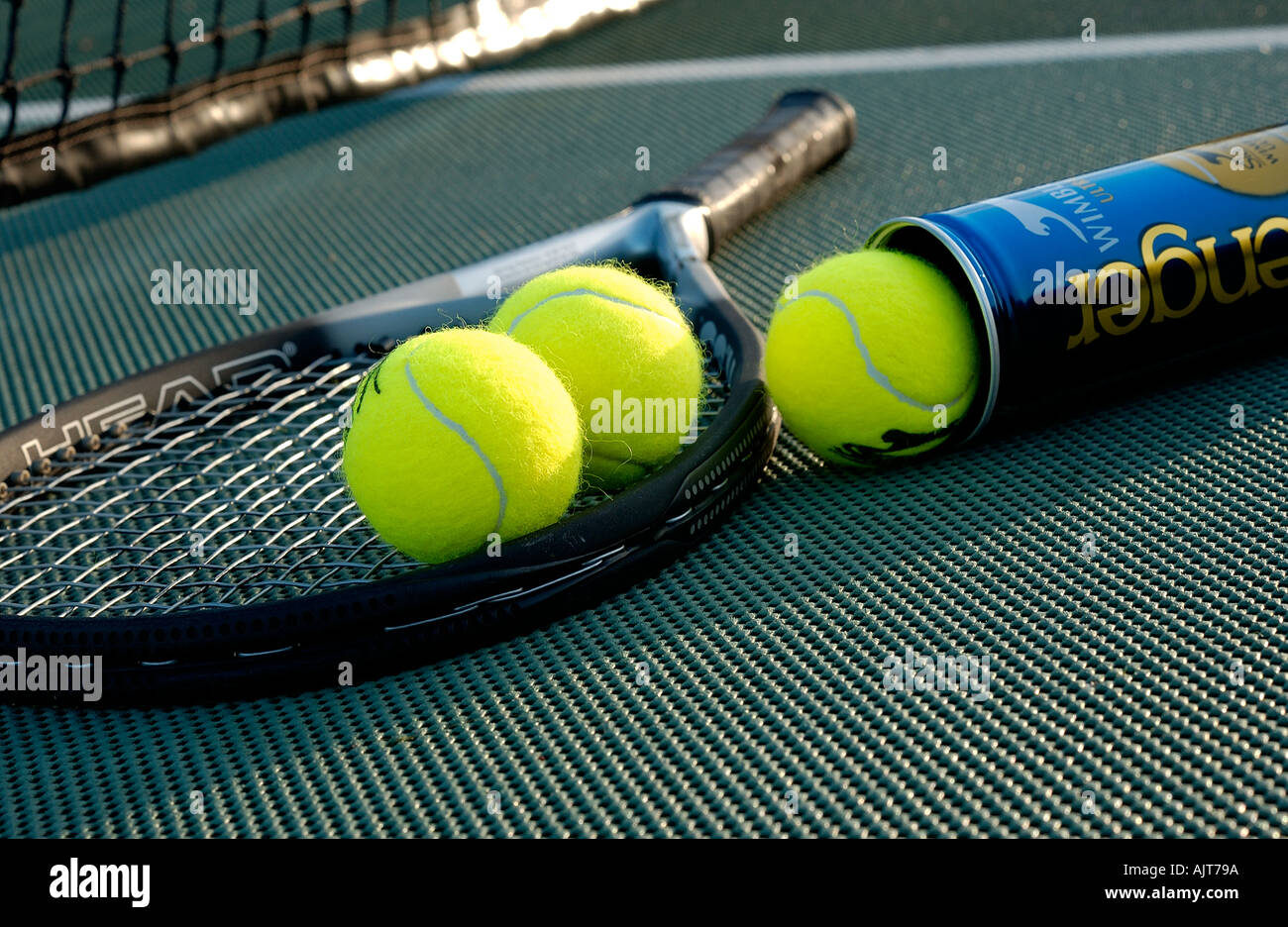 Tennis court racket balls and net Stock Photo - Alamy