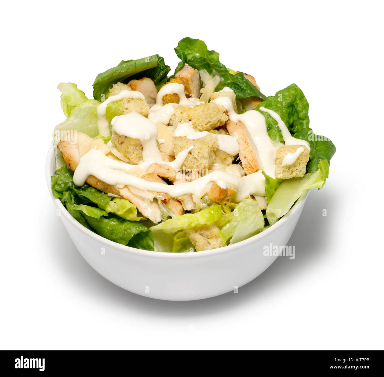 Caesar salad in a bowl cut out on a white background Stock Photo - Alamy
