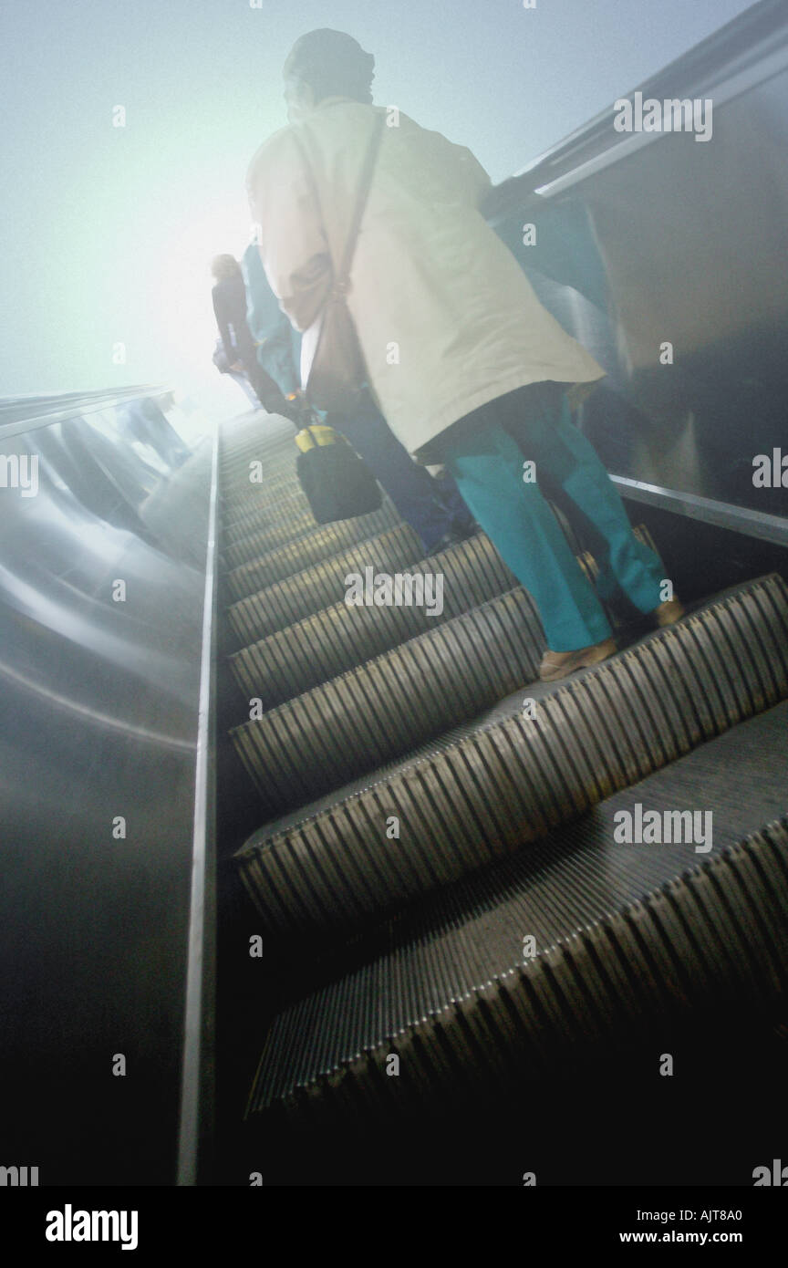 People on escalator Stock Photo - Alamy