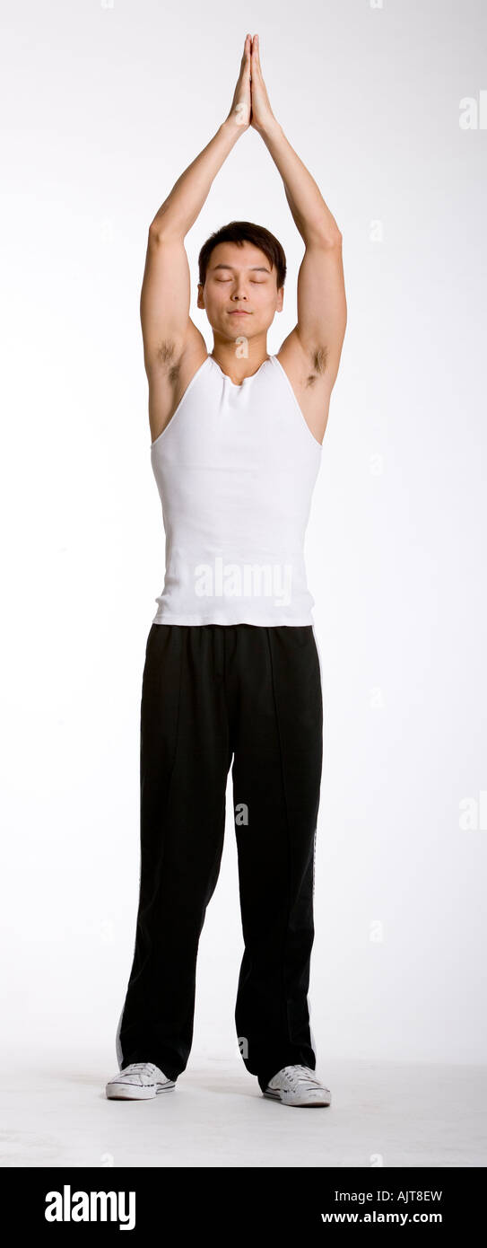 Young man meditating Stock Photo - Alamy