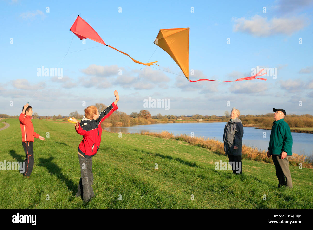 Friends flying kite hi-res stock photography and images - Alamy
