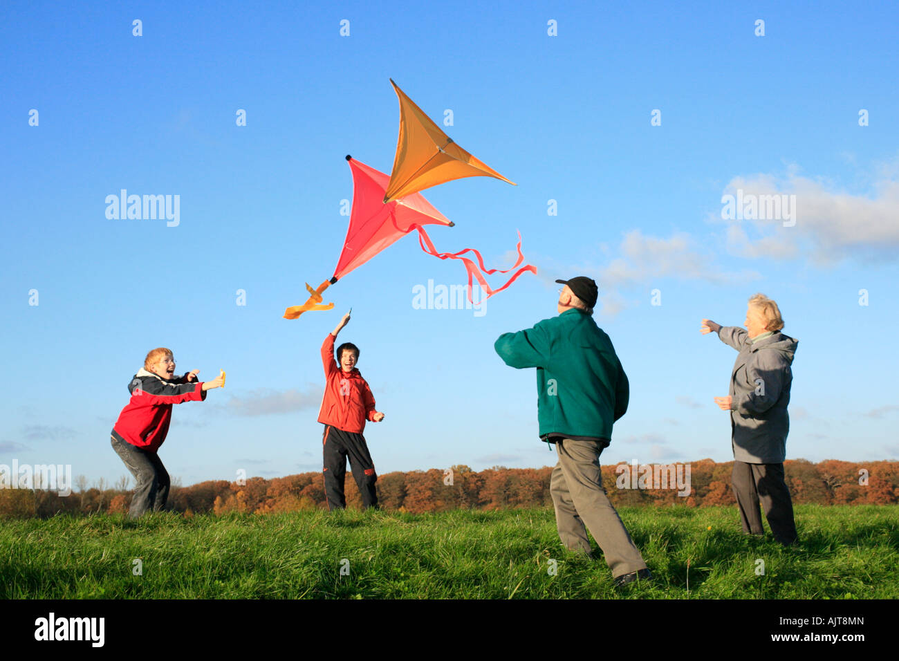 Old man and boy flying kite hi-res stock photography and images - Alamy
