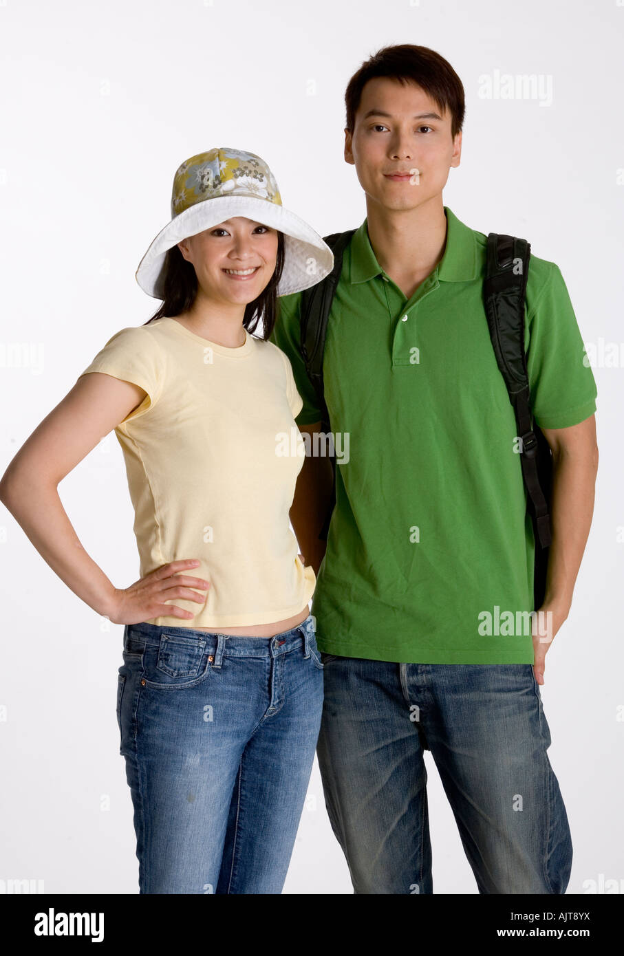 Portrait of a young couple standing Stock Photo - Alamy