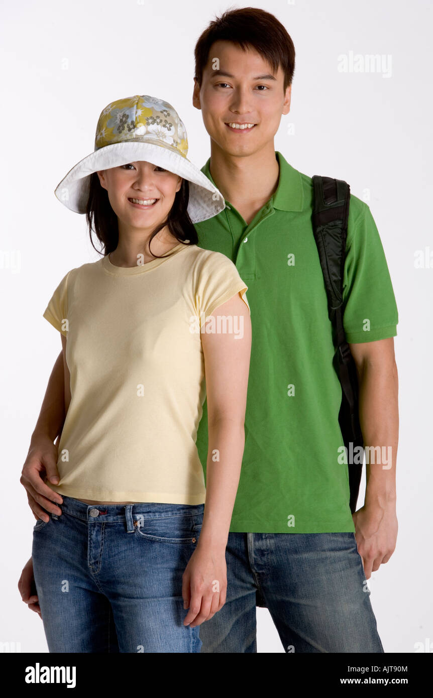 Portrait of a young couple smiling Stock Photo - Alamy