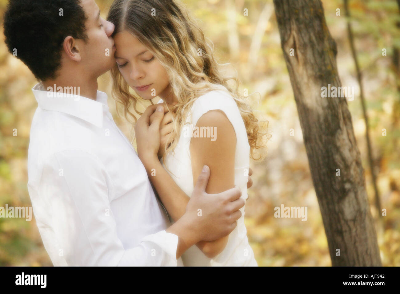 Young couple cuddles in hi-res stock photography and images - Alamy