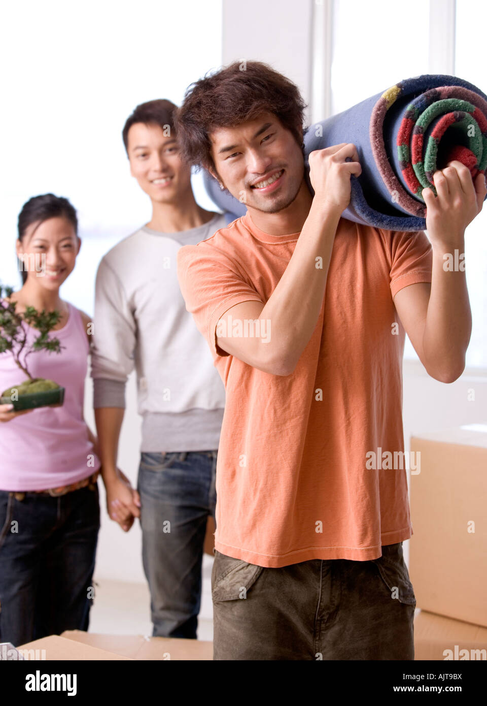 Two men carrying carpet hi-res stock photography and images - Alamy