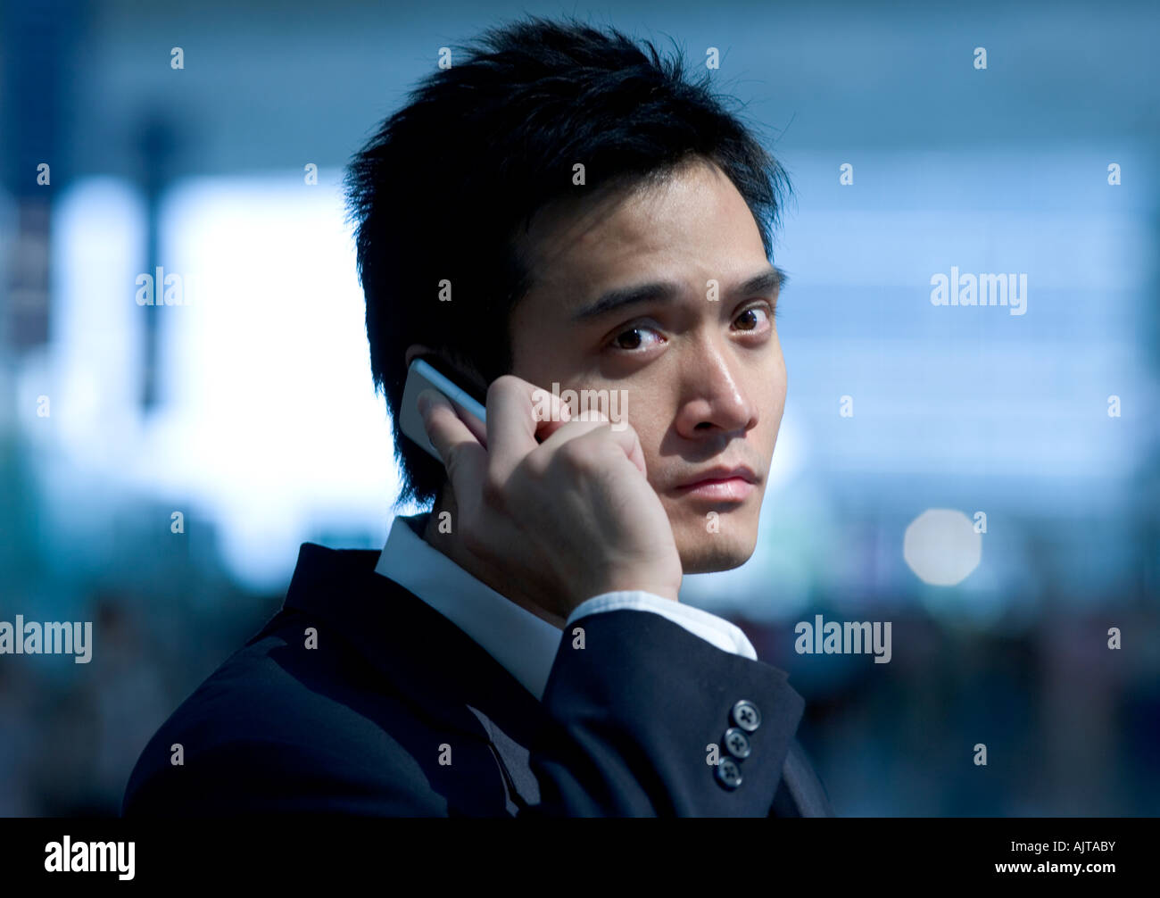 Portrait of a businessman using a mobile phone Stock Photo - Alamy