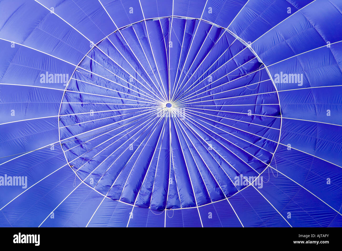 Close up of the top of a blue hot air balloon during inflation Stock ...