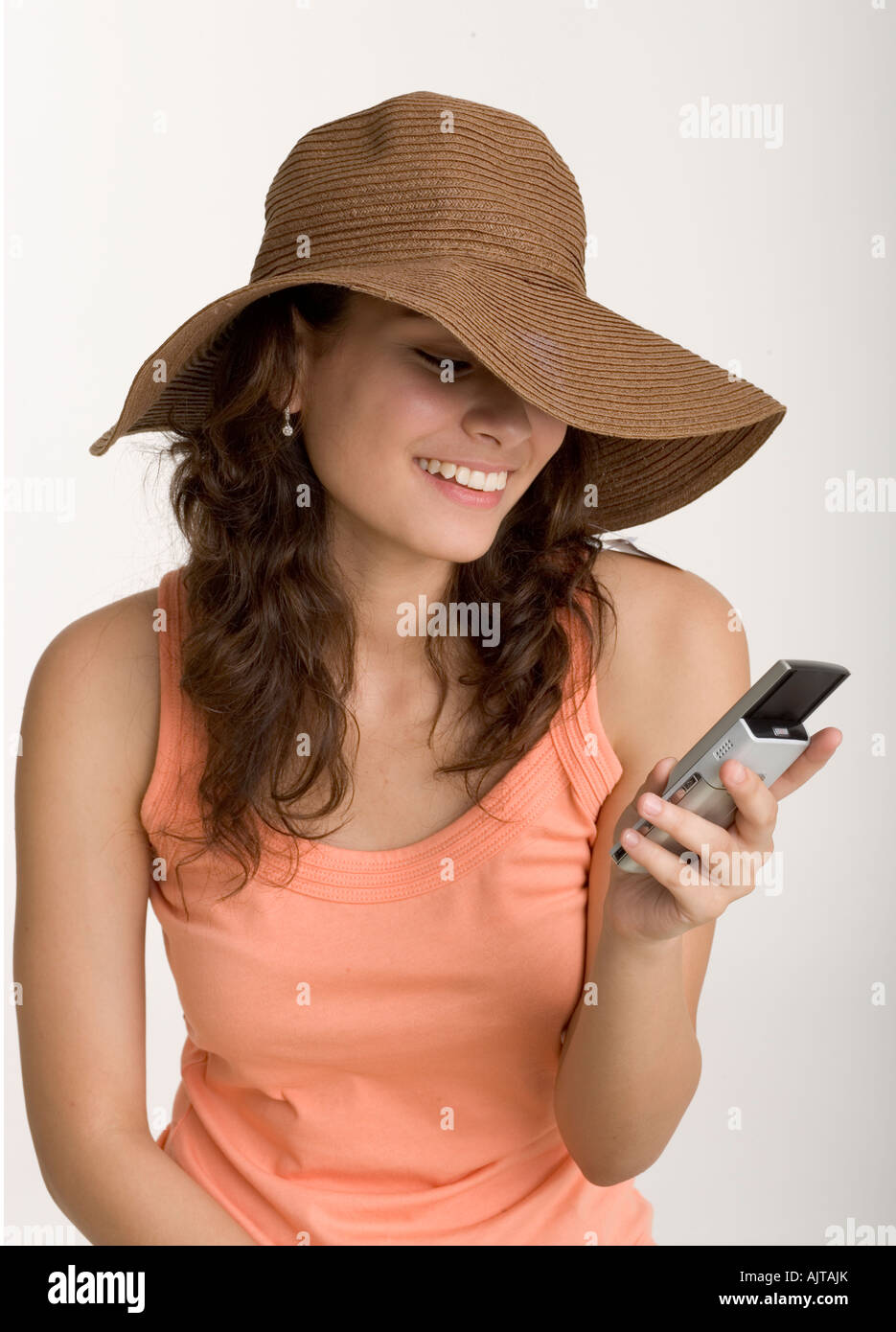 Young woman operating a mobile phone Stock Photo - Alamy