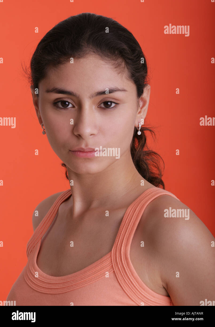 Portrait of a young woman looking serious Stock Photo - Alamy