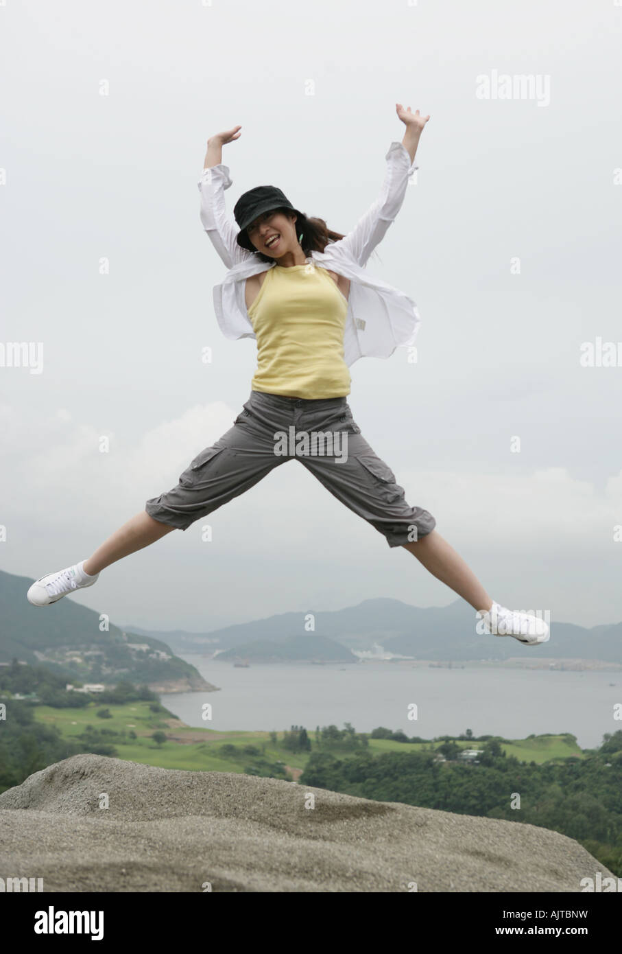 Young woman jumping Stock Photo - Alamy