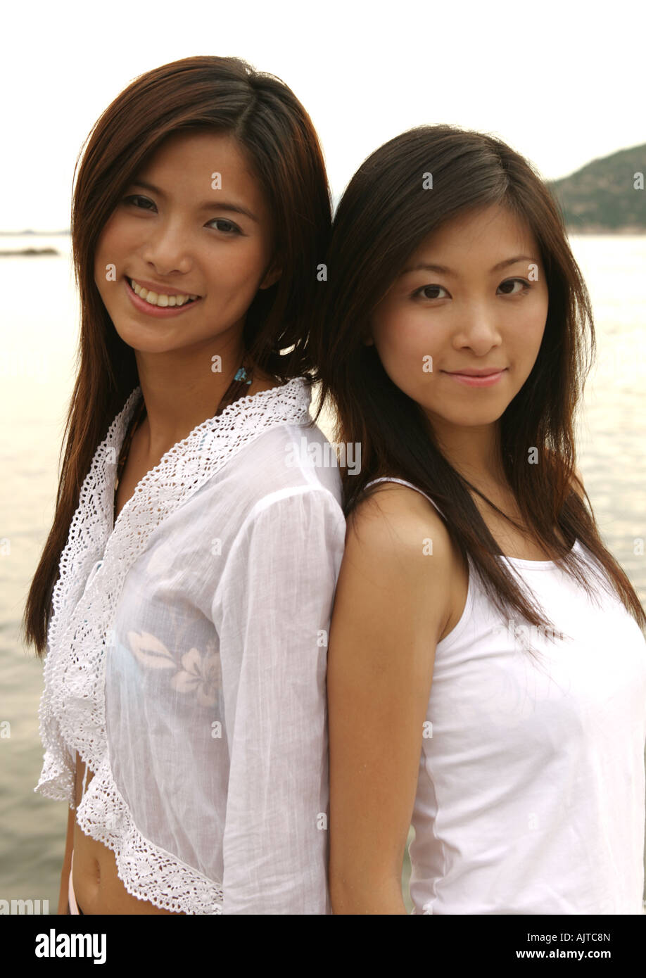 Standing back to back female only hi-res stock photography and images ...