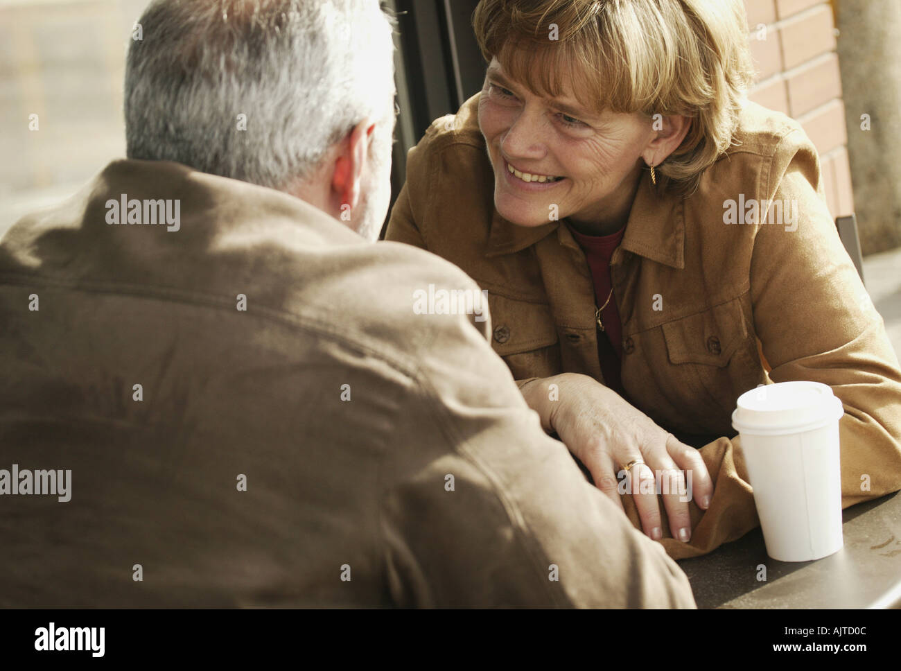 Couple talking over coffee Stock Photo - Alamy