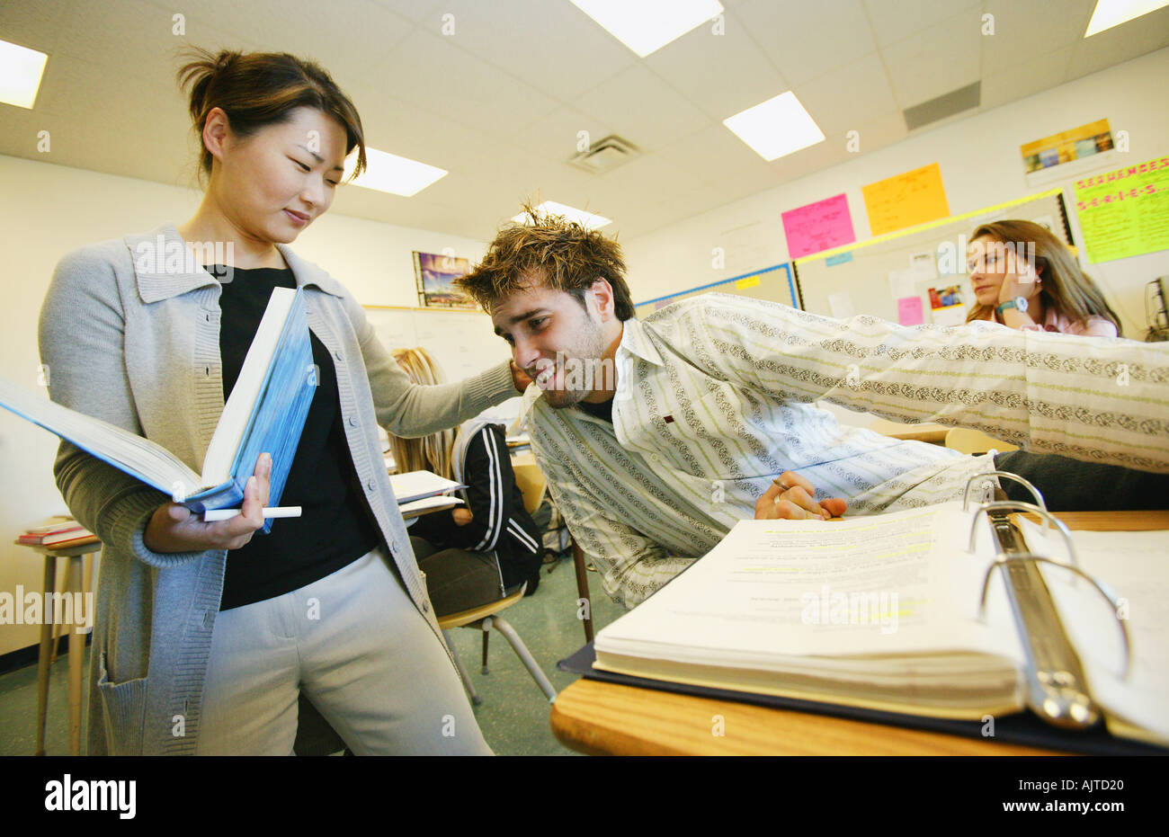 Teacher pulling students ear Stock Photo - Alamy