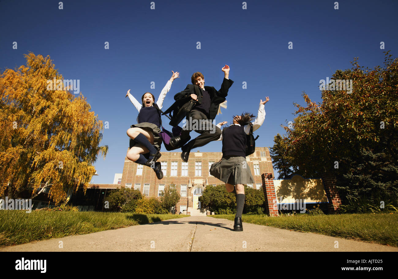 Students jumping uniform hi-res stock photography and images - Alamy