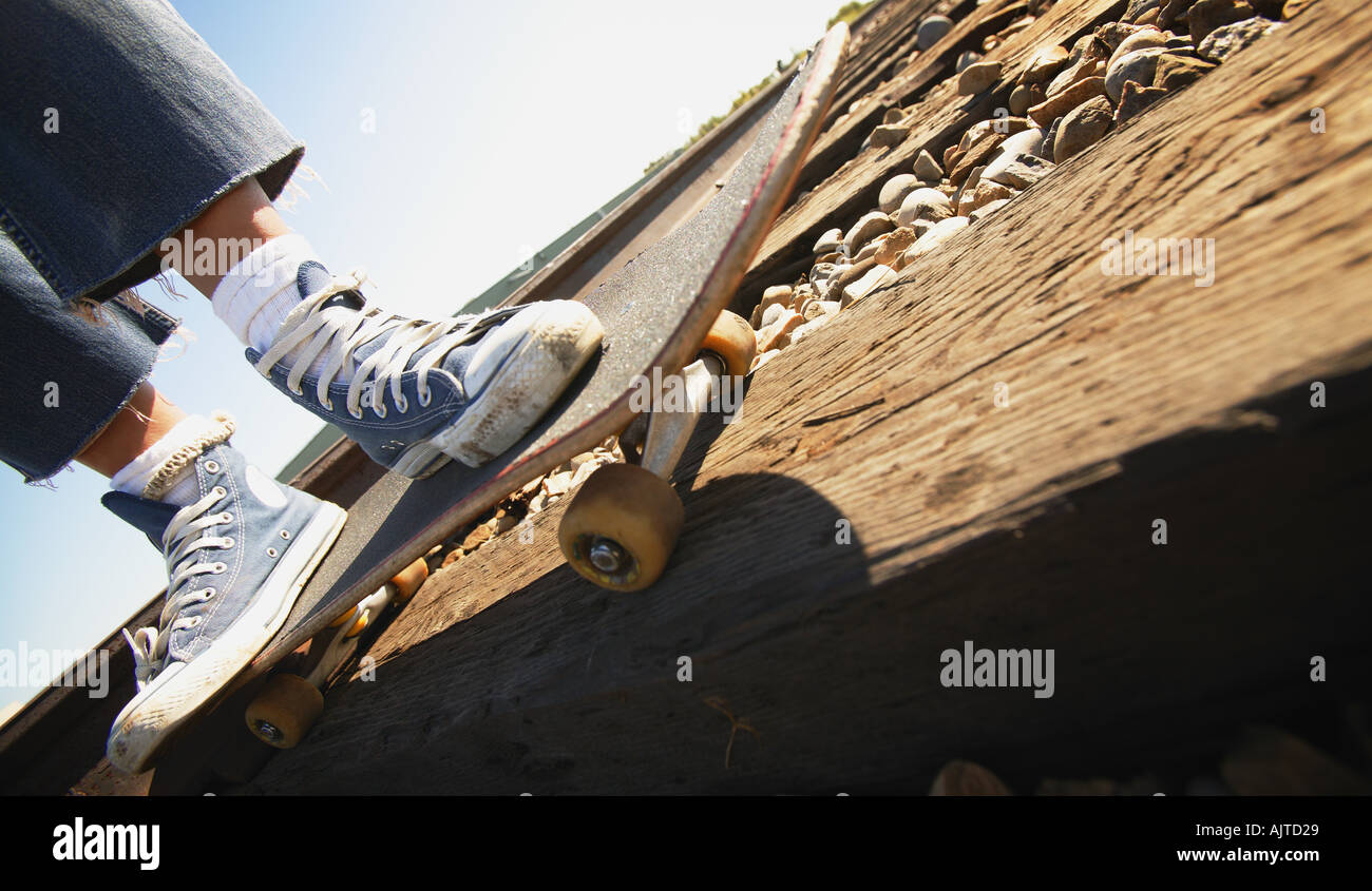 Feet on skateboard Stock Photo - Alamy