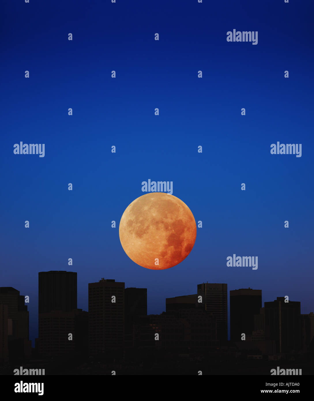 Orange moon in dark sky Stock Photo - Alamy