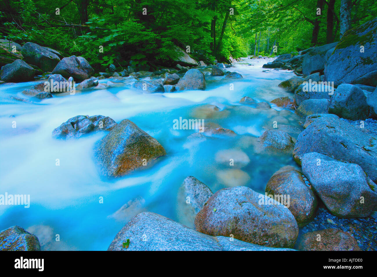 Water rushing through rocks Stock Photo - Alamy