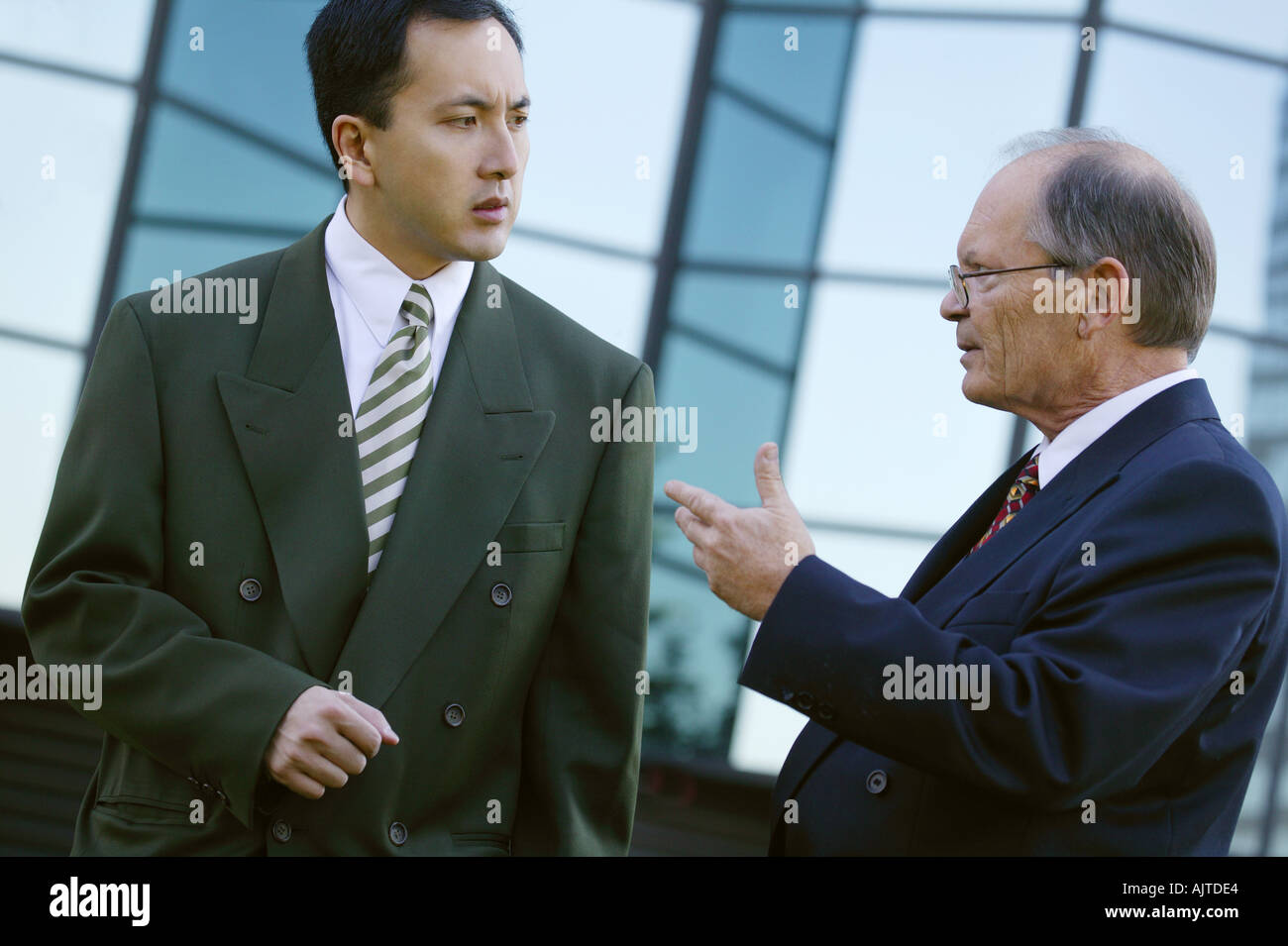 Businessmen in discussion Stock Photo - Alamy