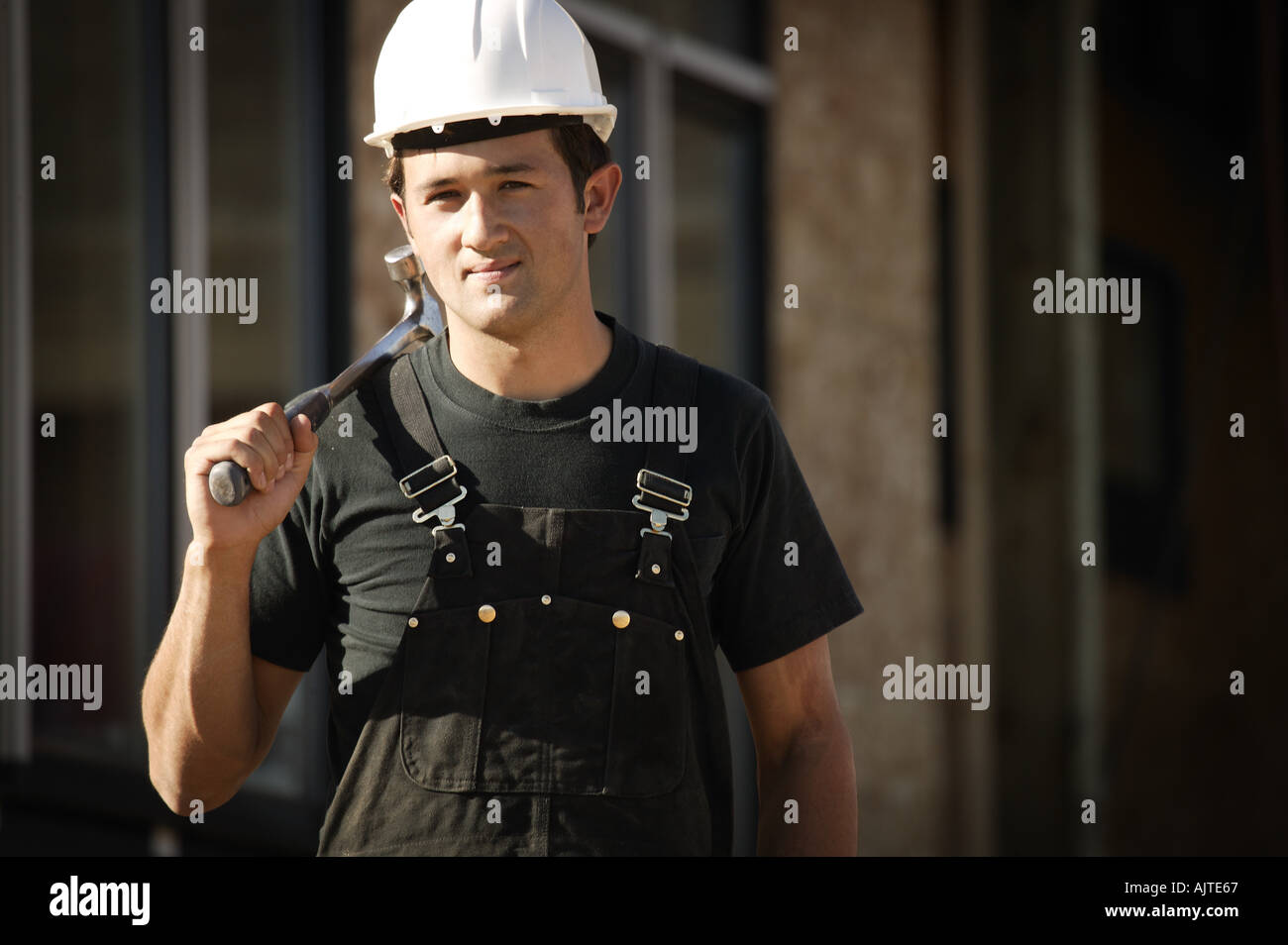 Worker with hammer Stock Photo - Alamy