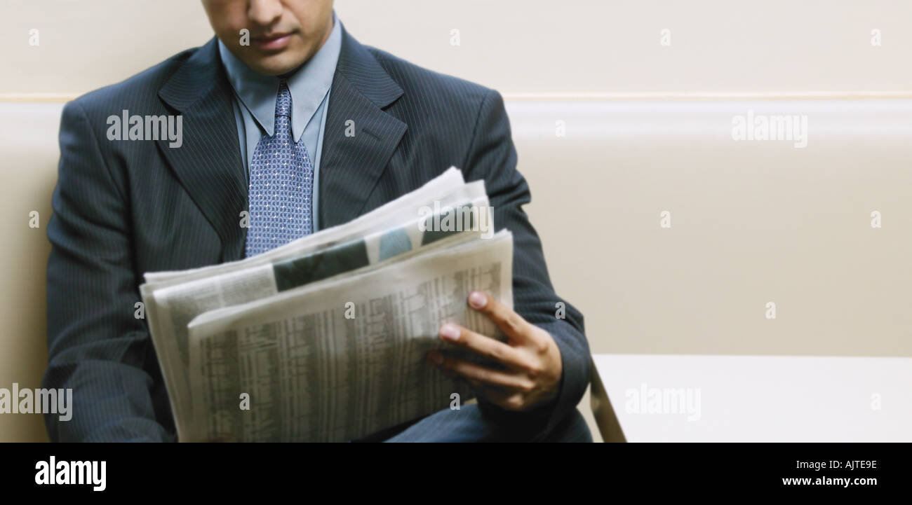 Man reading the newspaper Stock Photo - Alamy
