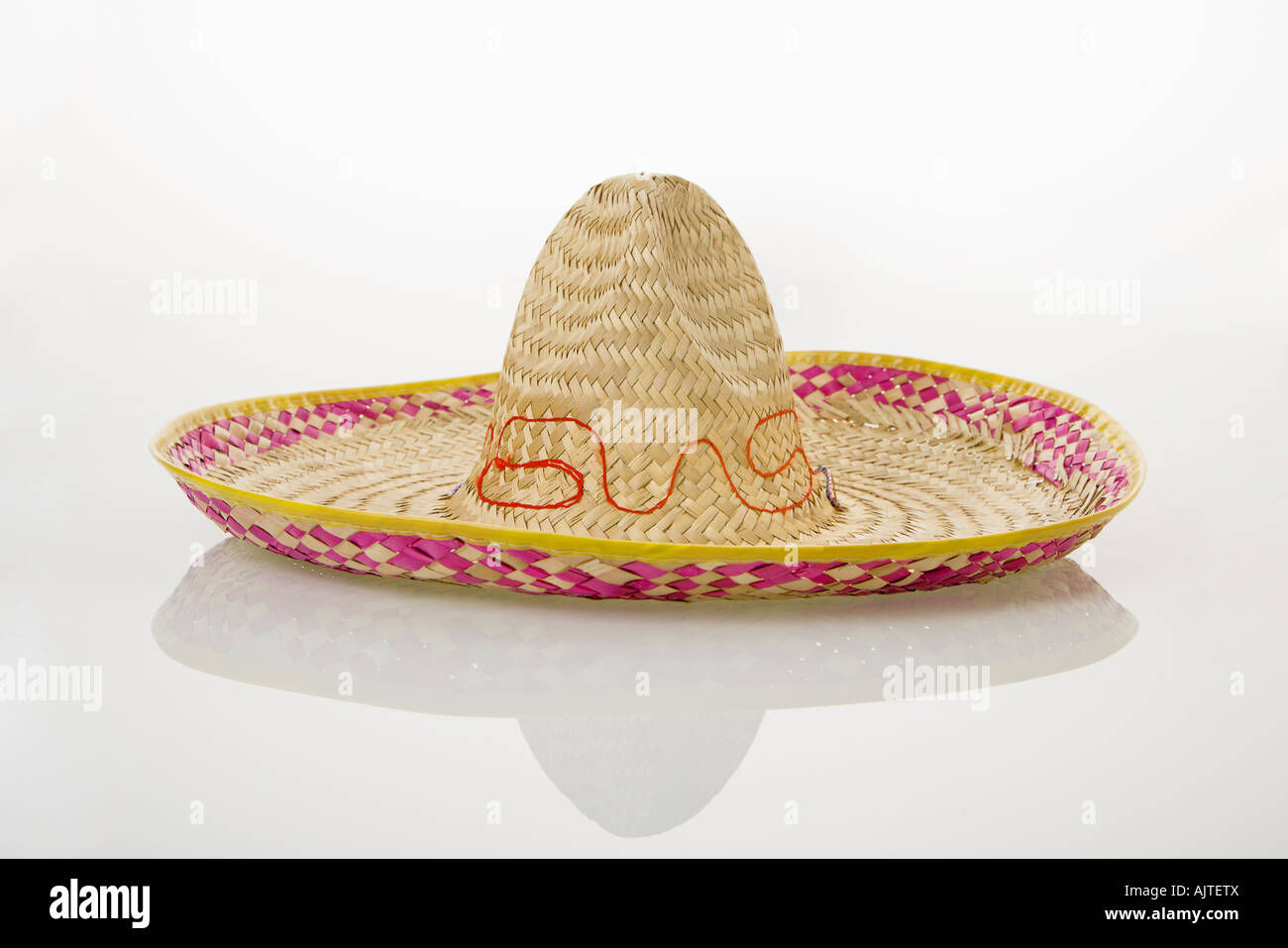 Mexican straw sombrero hat on white background Stock Photo - Alamy