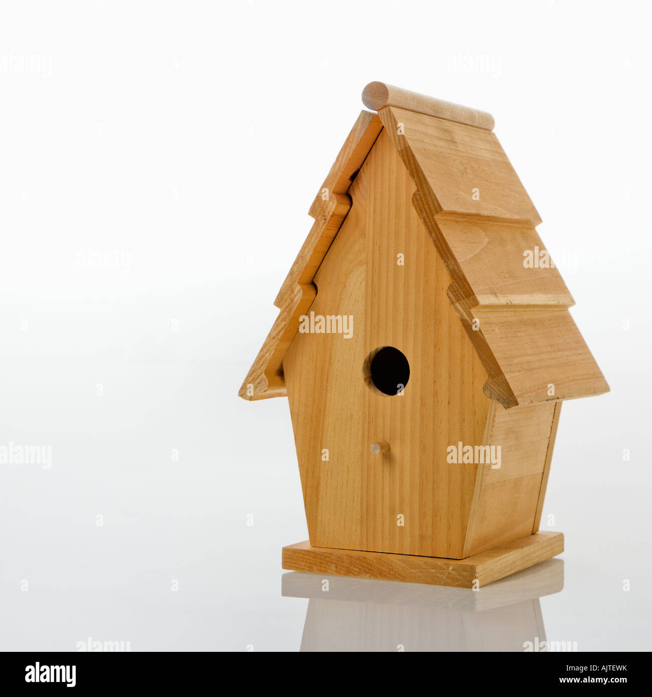 Wooden birdhouse against white background Stock Photo - Alamy